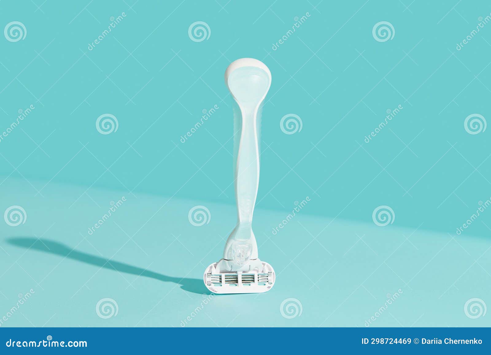 Minimalist Elegance: Razor in Sharp Relief Against a Bold Blue Backdrop ...