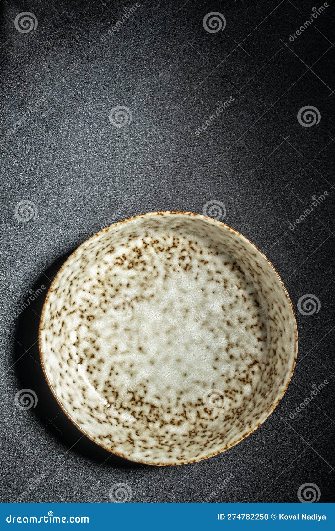 Minimalist Handmade Ceramic Plate on a Black Concrete Table, Top View ...