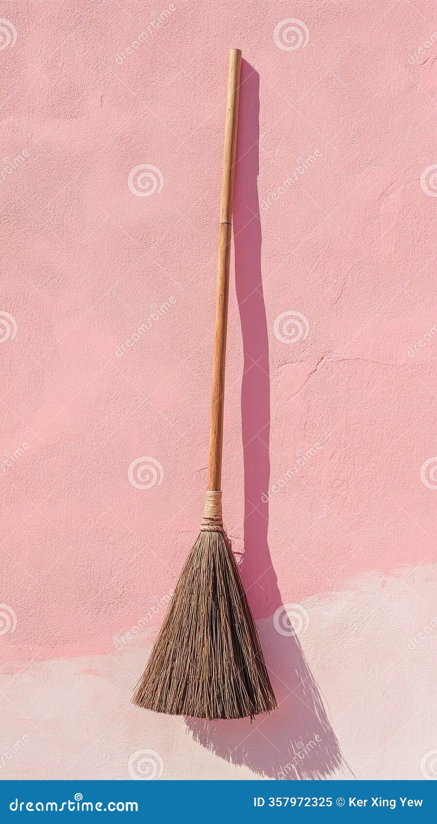 A Minimalist Pink Wall with a Stylish Broom: Embracing Home Aesthetics ...