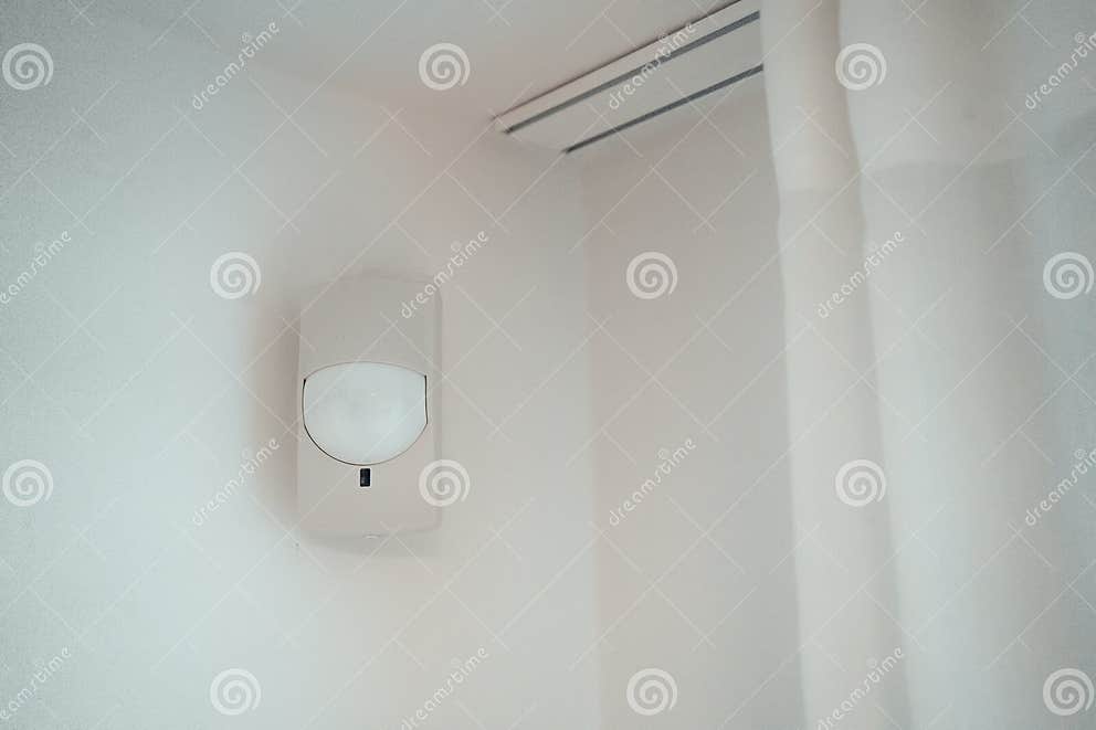 Minimalist Wall-Mounted Motion Sensor in a Modern Interior Stock Photo - Image of bathroom ...