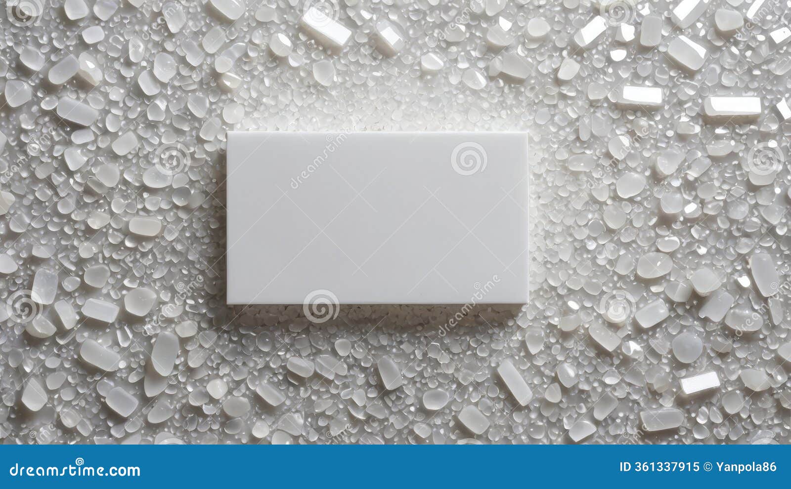 Minimalist White Rectangle on a Bed of Textured Stones and Droplets ...