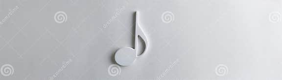 A Minimalistic Art Piece Featuring a Single Musical Note on a Pristine ...