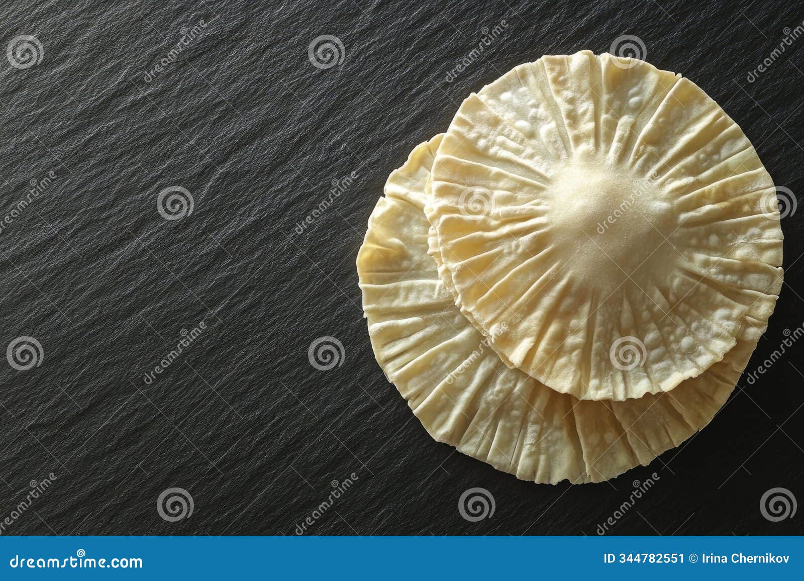 Minimalistic Display of Empanadas on Black Slate Surface for Culinary ...