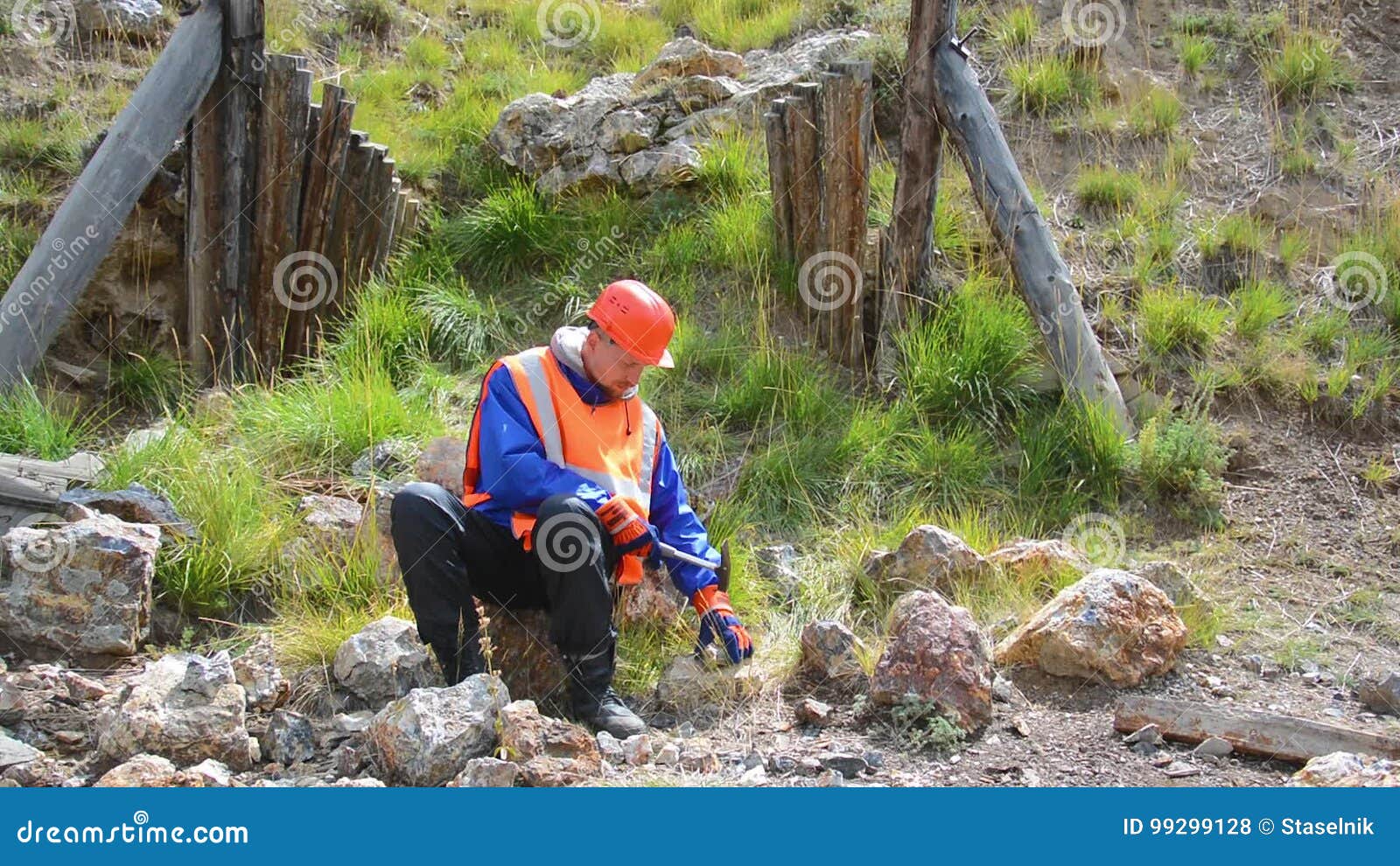 A Mining Engineer or Geologist Wearing Gloves, a Helmet, a Reflective ...
