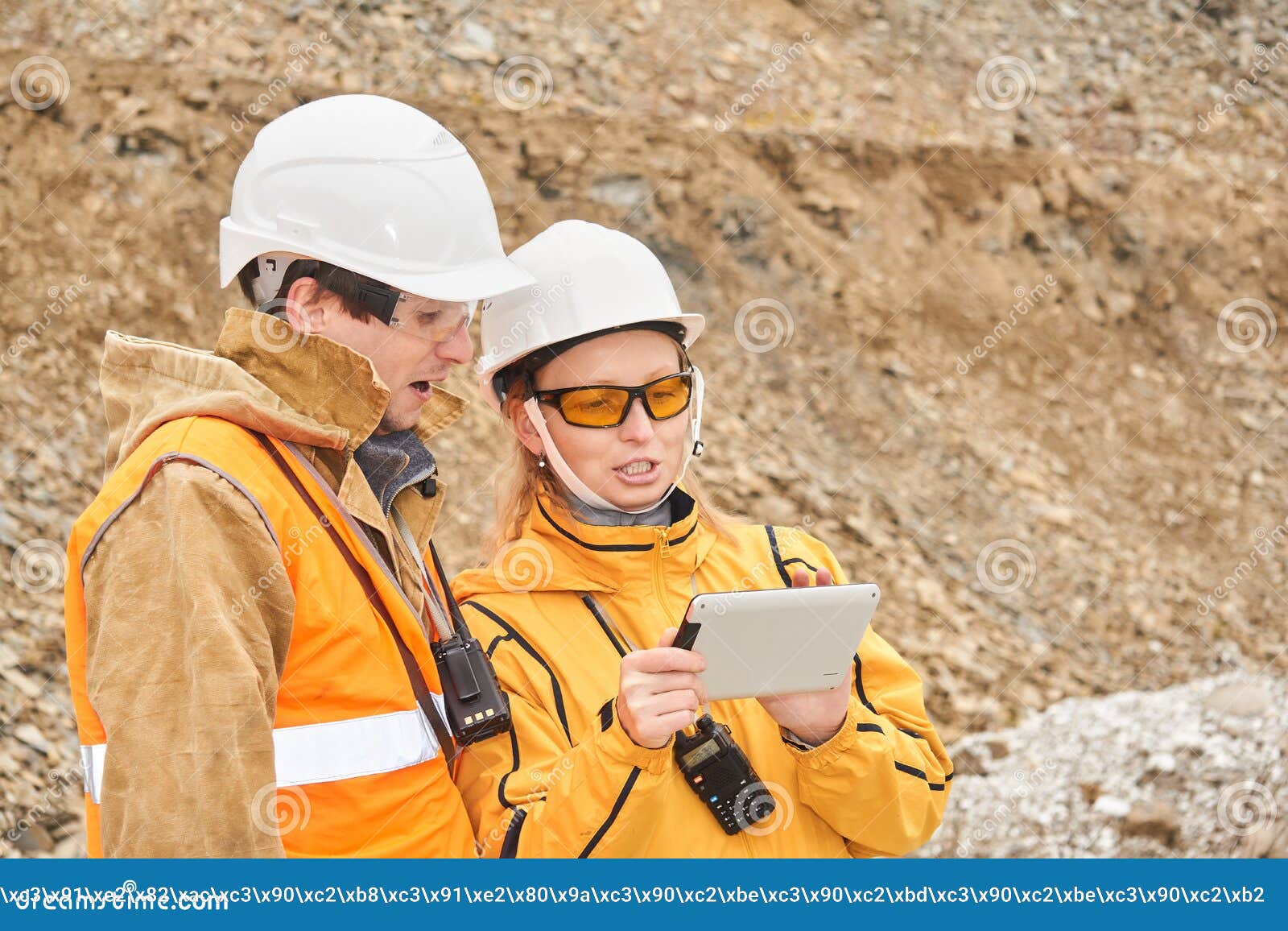 Mining Engineers Discussing Working Documentation at the Mining Site ...