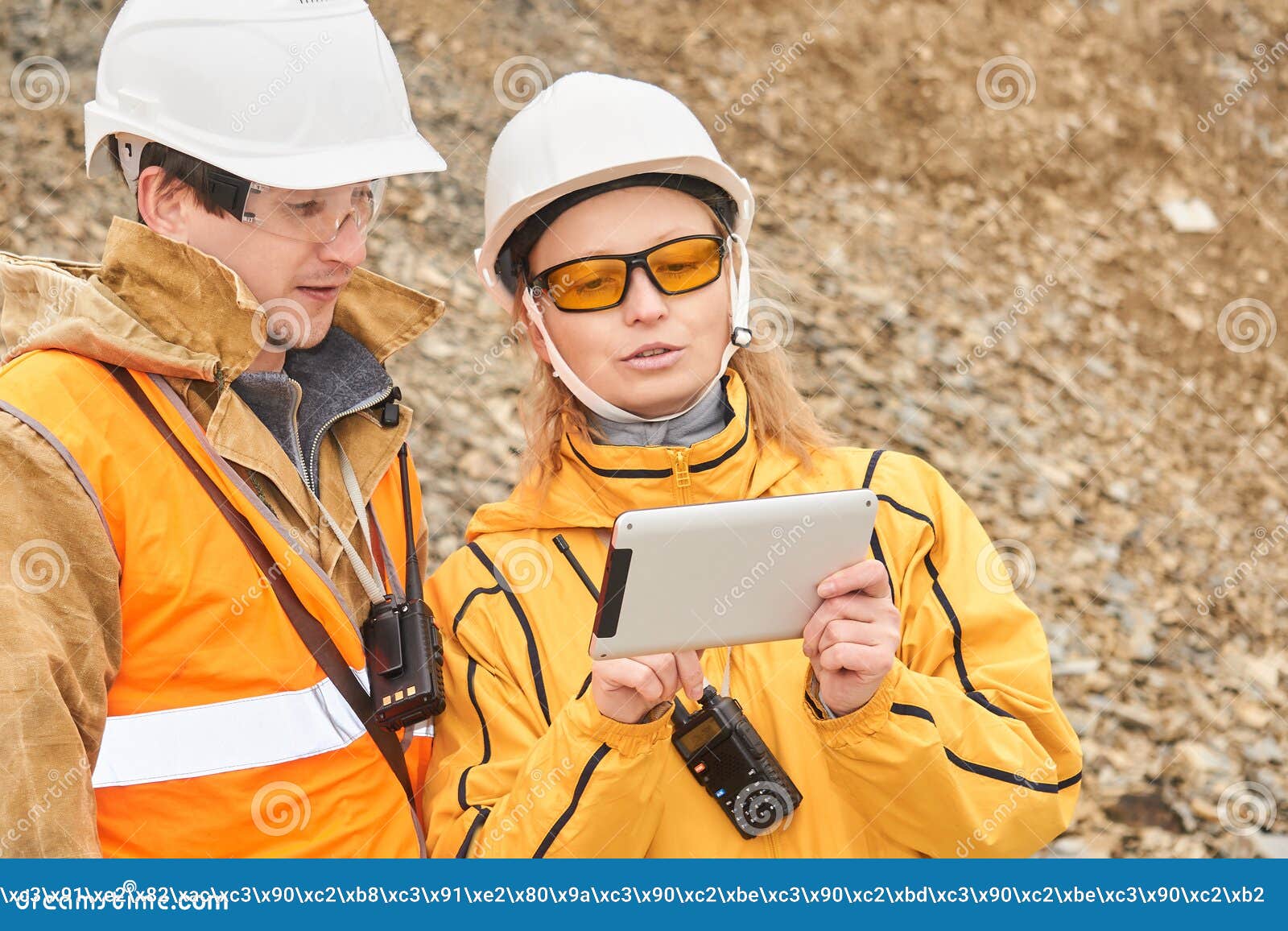 Mining Engineers Discussing Working Documentation at the Mining Site ...