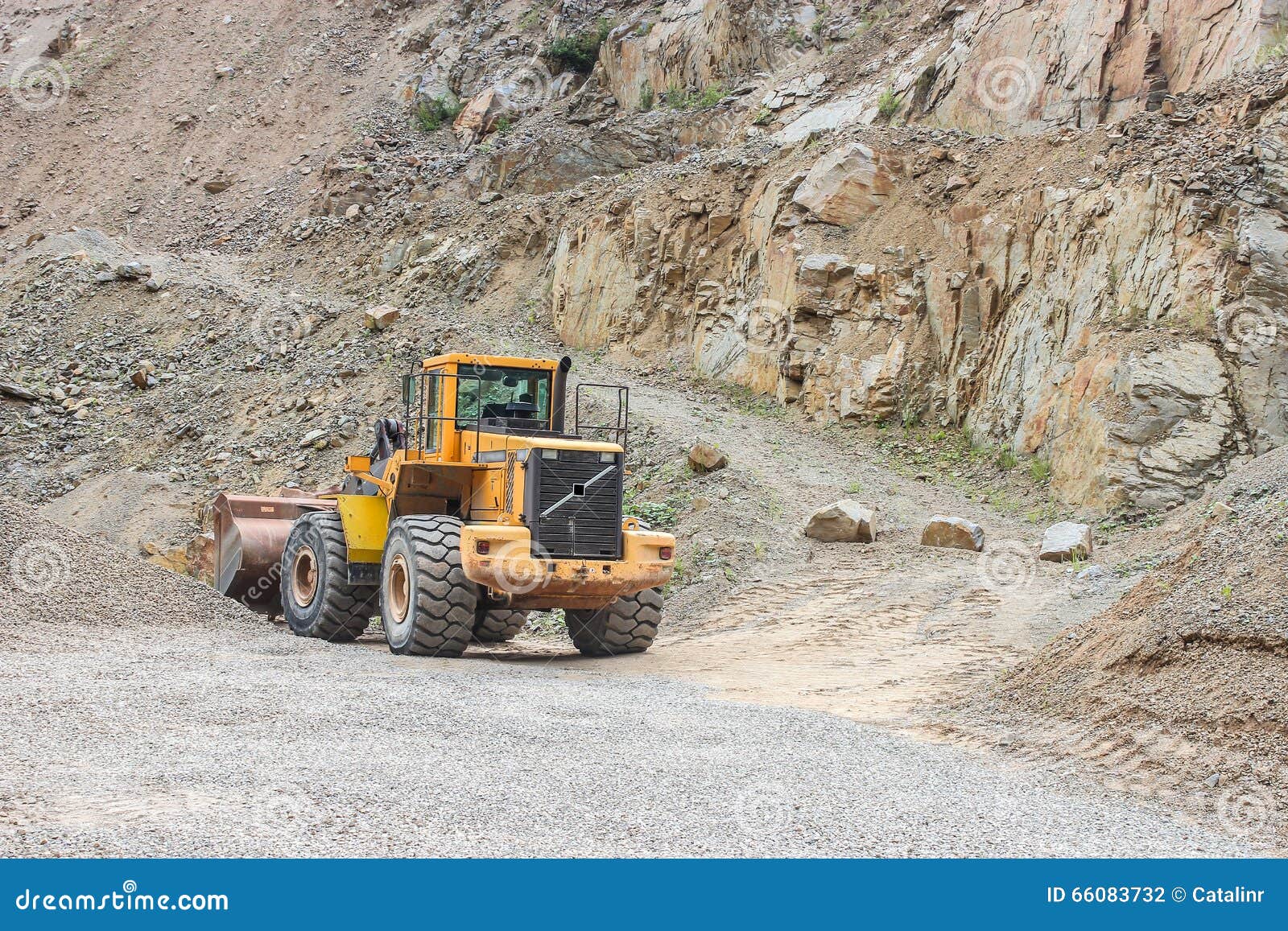 Excavator In A Stone Extraction Mine To Transform Into A Gravel Royalty ...