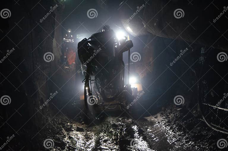 Mining Operator on Mining Machine, Underground Mine Mesh. Stock Photo ...
