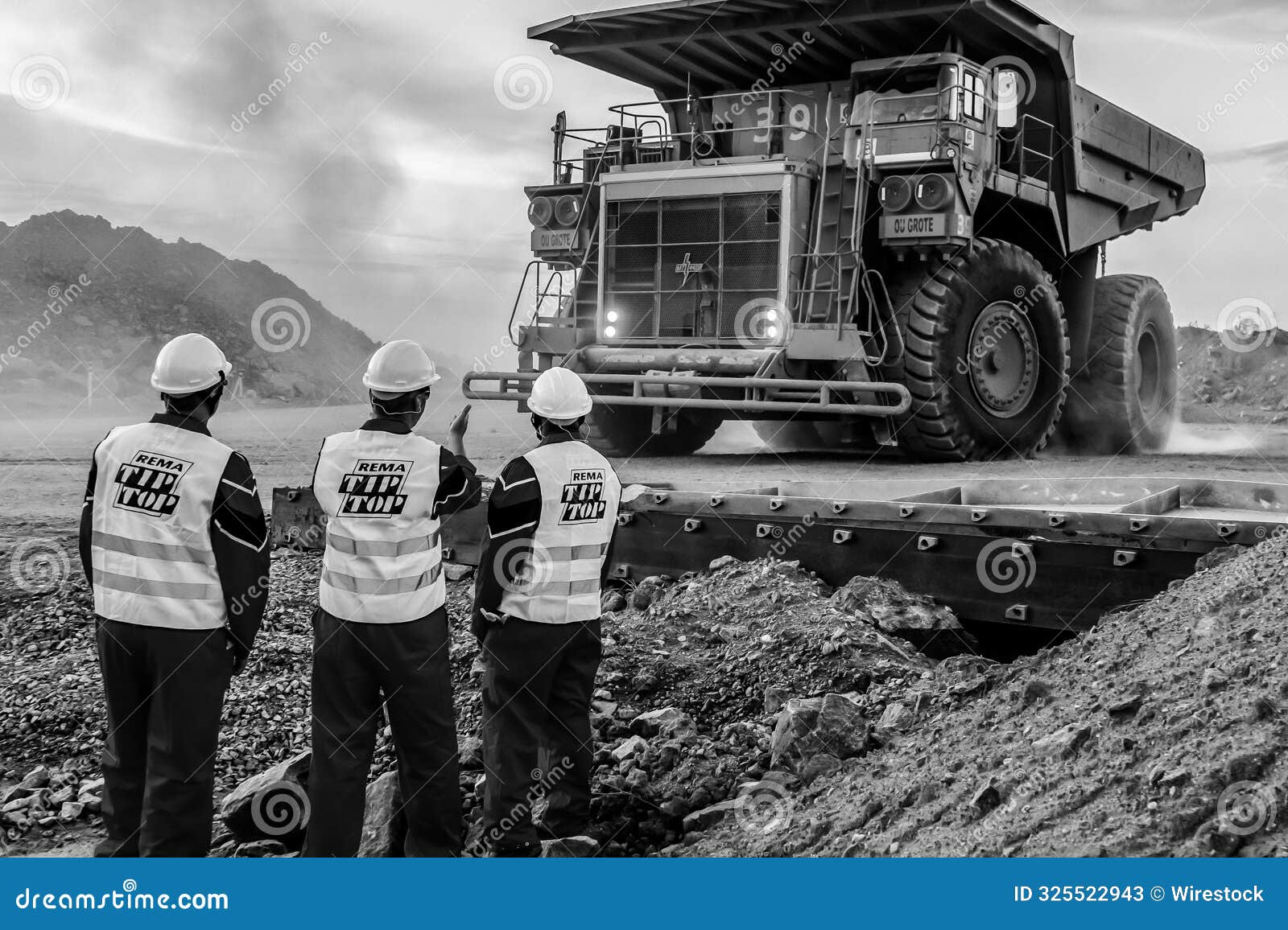 Mining Safety Inspectors with Large Dump Truck Transporting Platinum ...