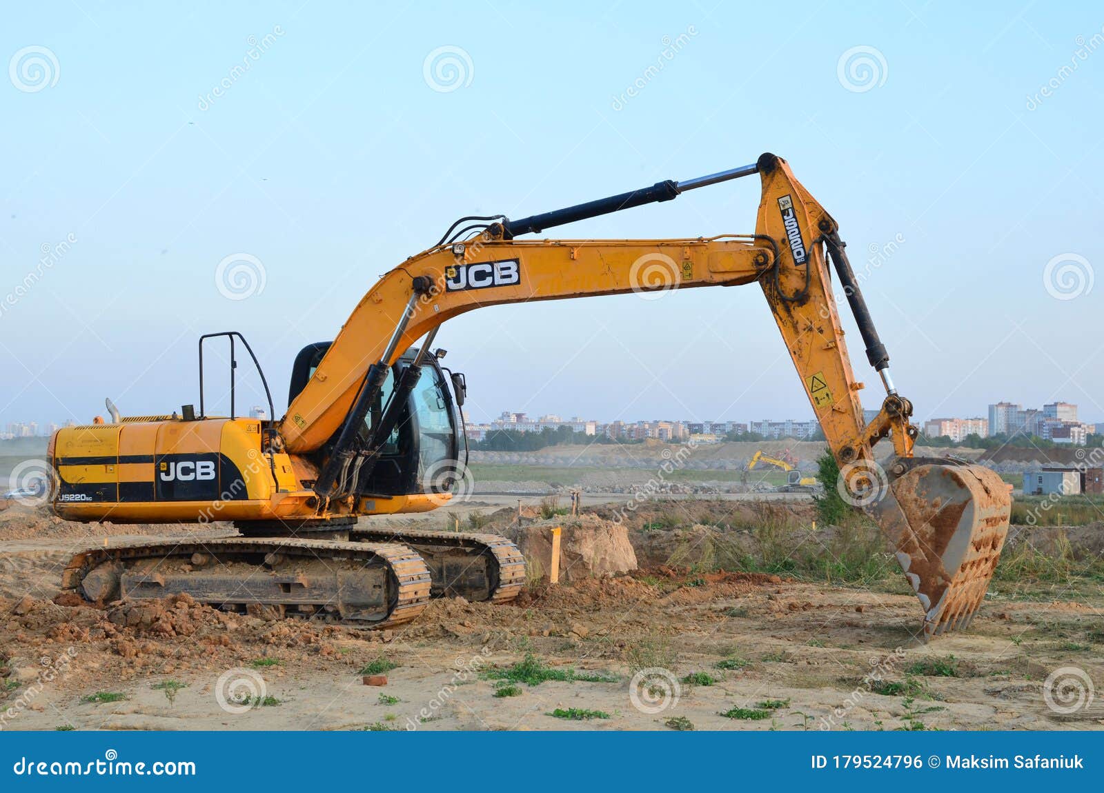 Excavator JCB JS 220 SC in a Working at Construction Site Editorial ...