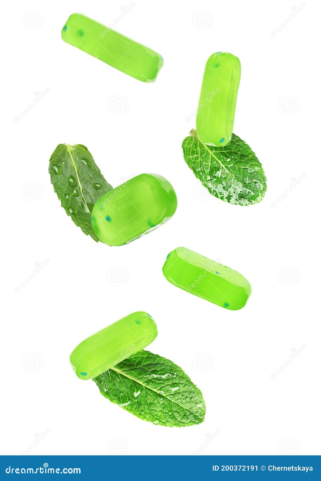 Mint Hard Candies and Green Leaves Falling on White Background Stock ...