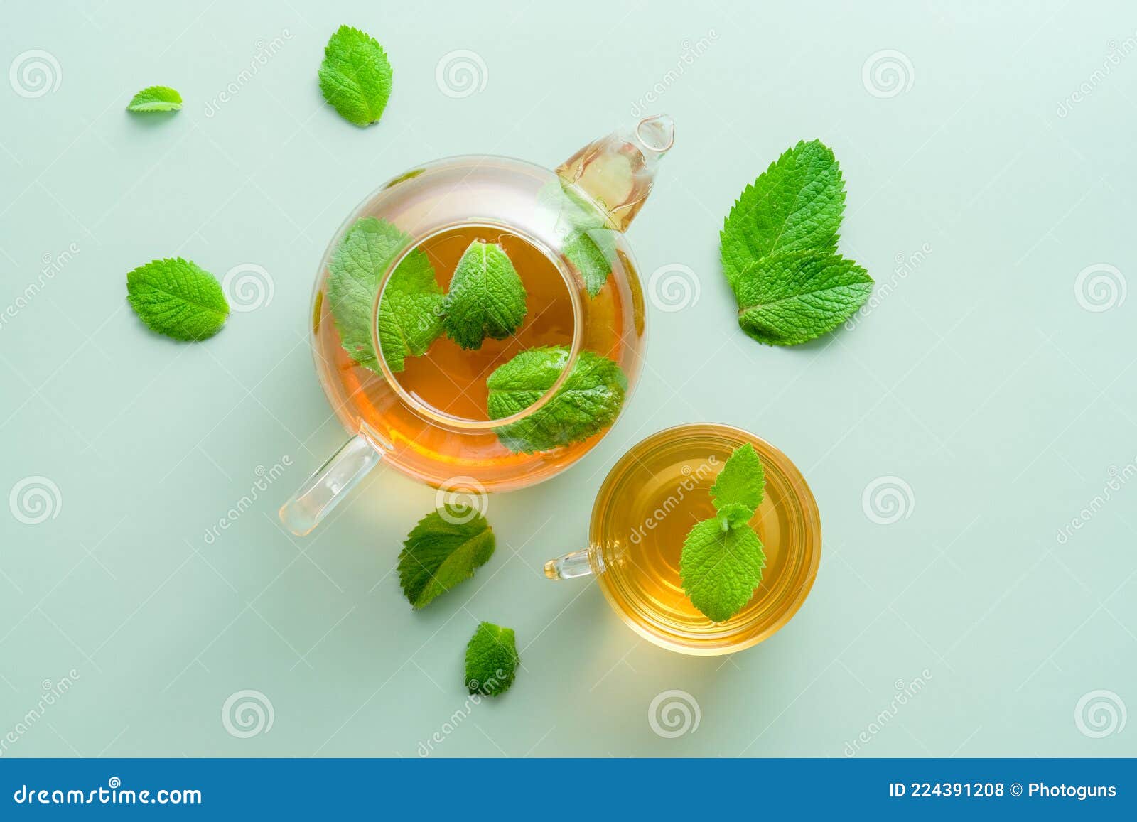 Mint Tea in Pot and Cup with Green Leaves on Table. Flat Lay, Top View ...