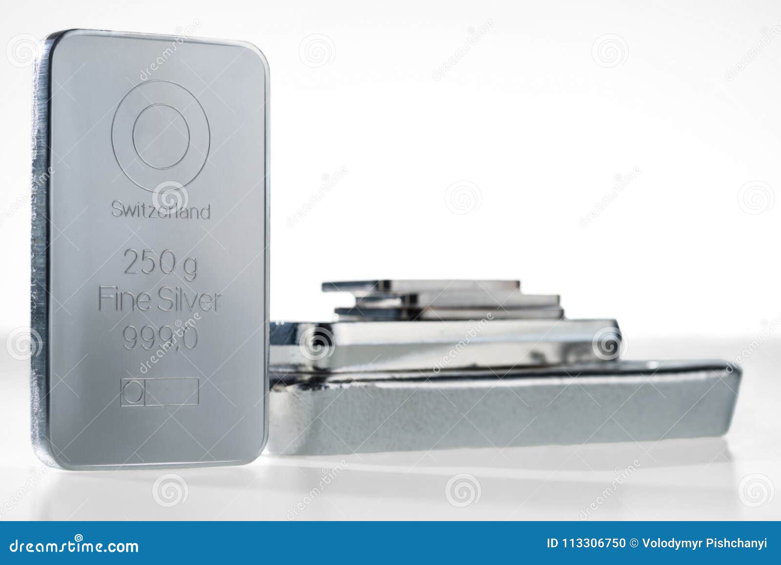 Minted Silver Bar Weighing 250 Grams and Stack of Silver Ingots Stock ...