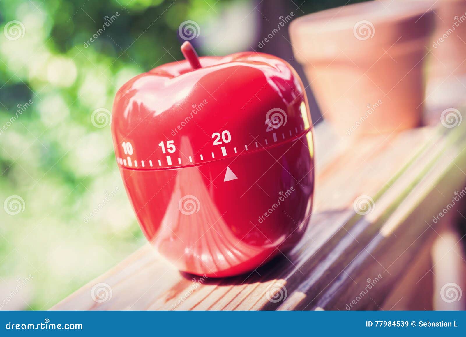 20 Minute Kitchen Egg Timer in Apple Shape Standing on a Handrail Stock ...