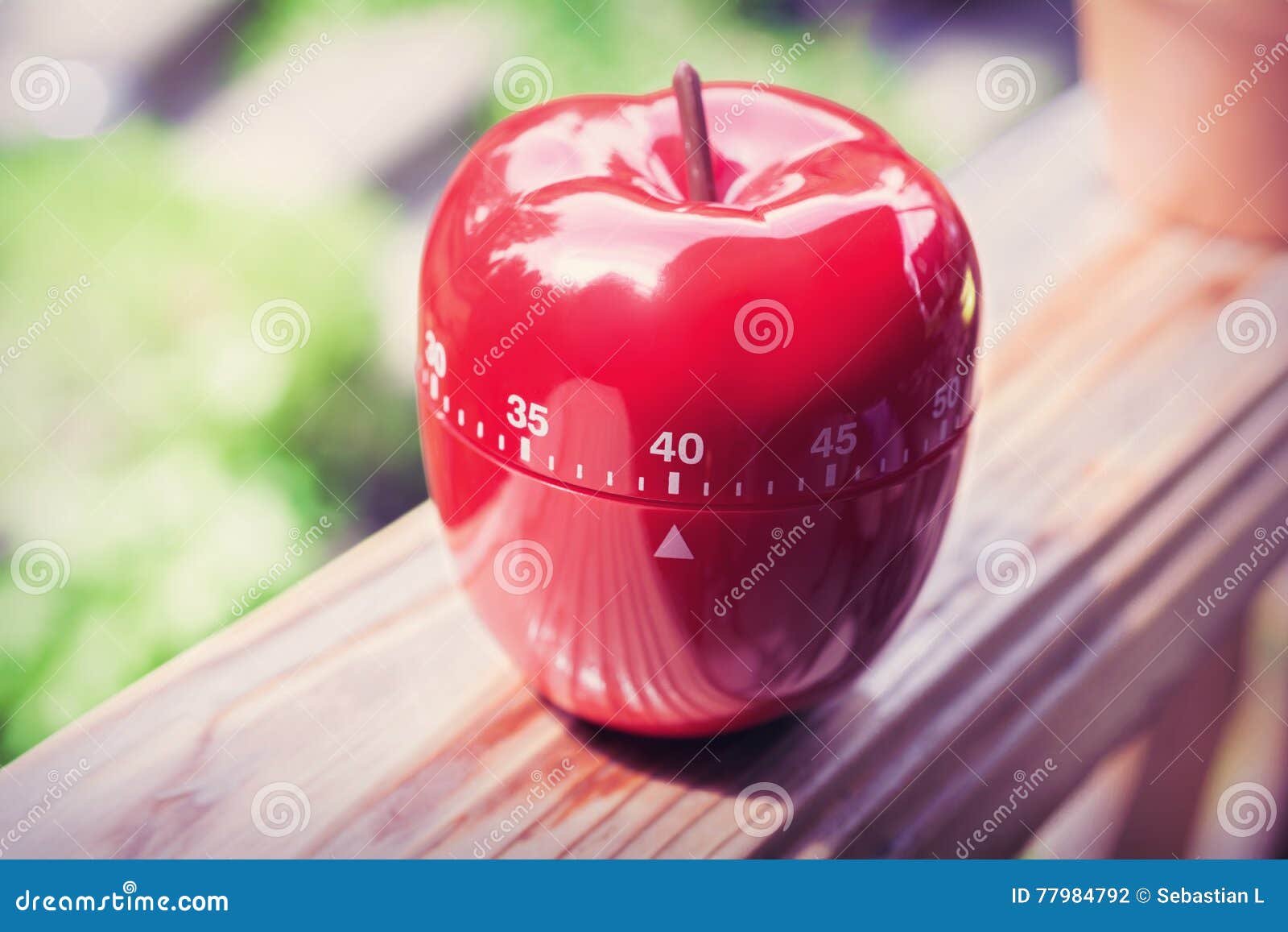 40 Minute Kitchen Egg Timer in Apple Shape Standing on a Handrail Stock ...