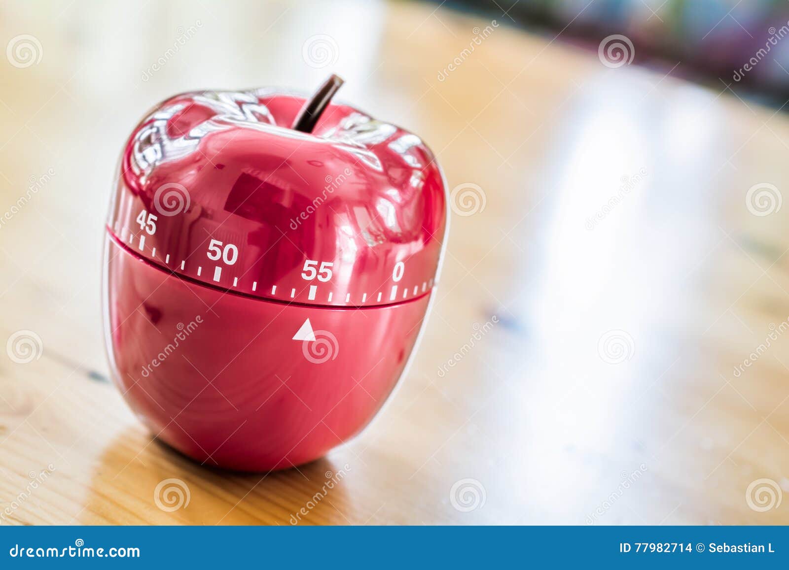 55 Minutes - Kitchen Egg Timer in Apple Shape on Wooden Table Stock ...