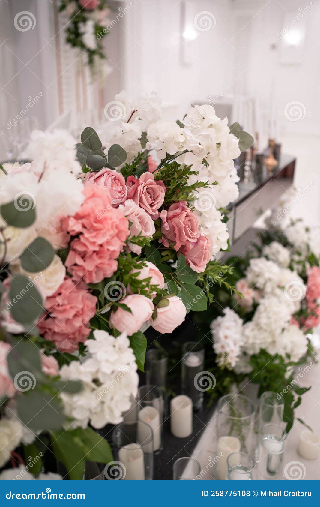 Mirror Main Table at a Wedding Reception with Beautiful Fresh Flowers ...