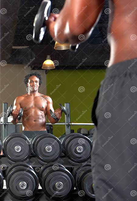 Mirror Reflection of Two Men Exercising in Gym Stock Image - Image of ...
