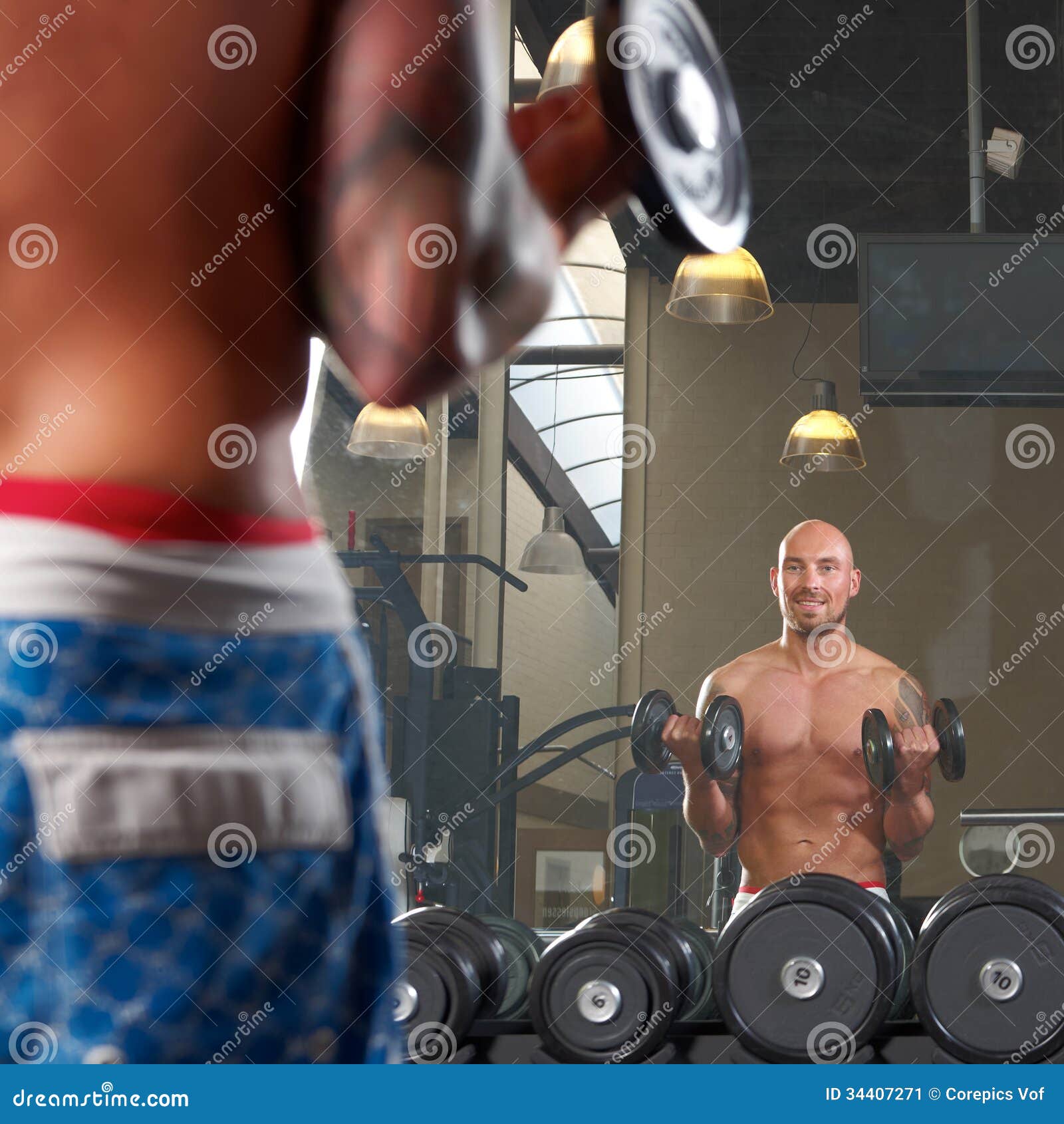 Mirror Reflection of Two Men Exercising in Gym Stock Image - Image of ...