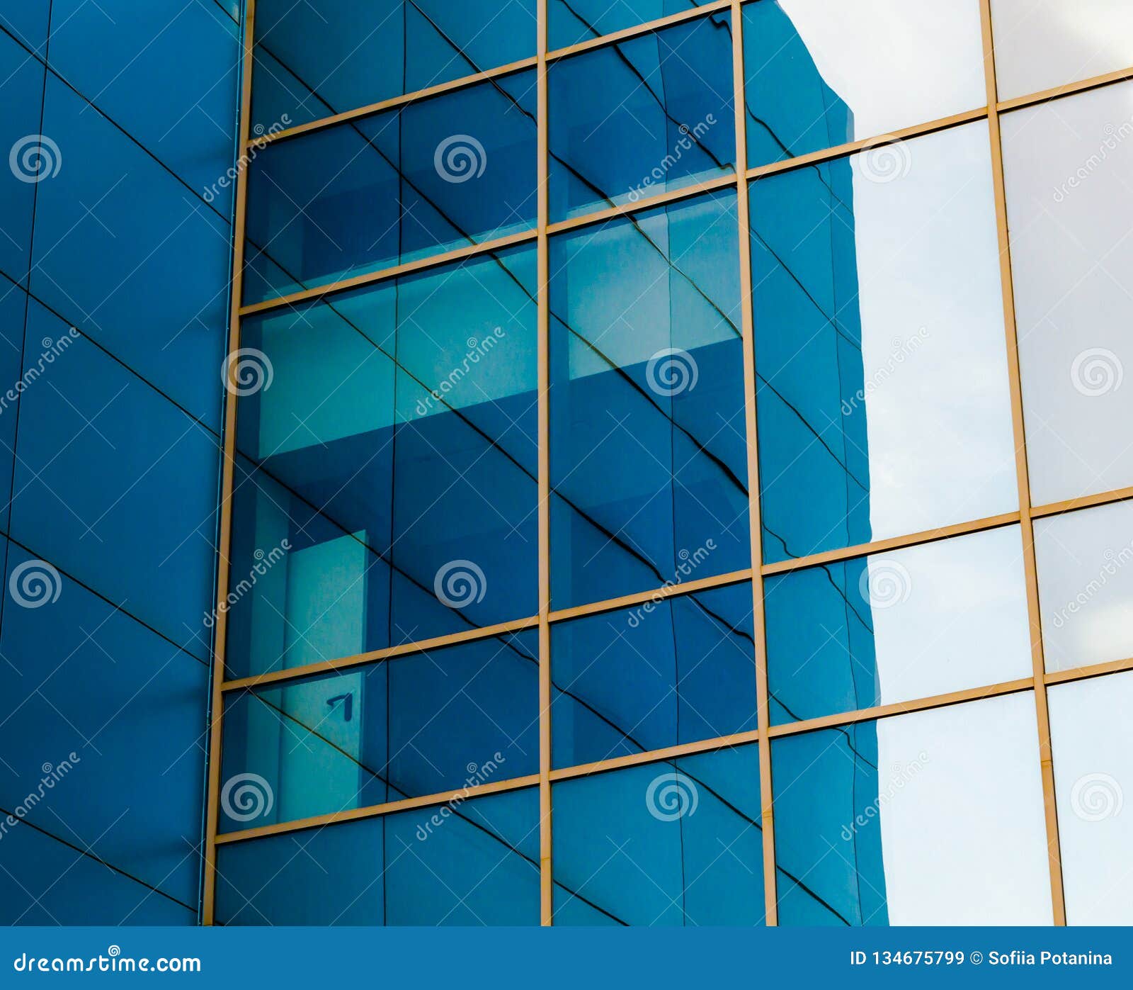 Mirrored Windows of the Facade of an Office Building with Blue Panels ...