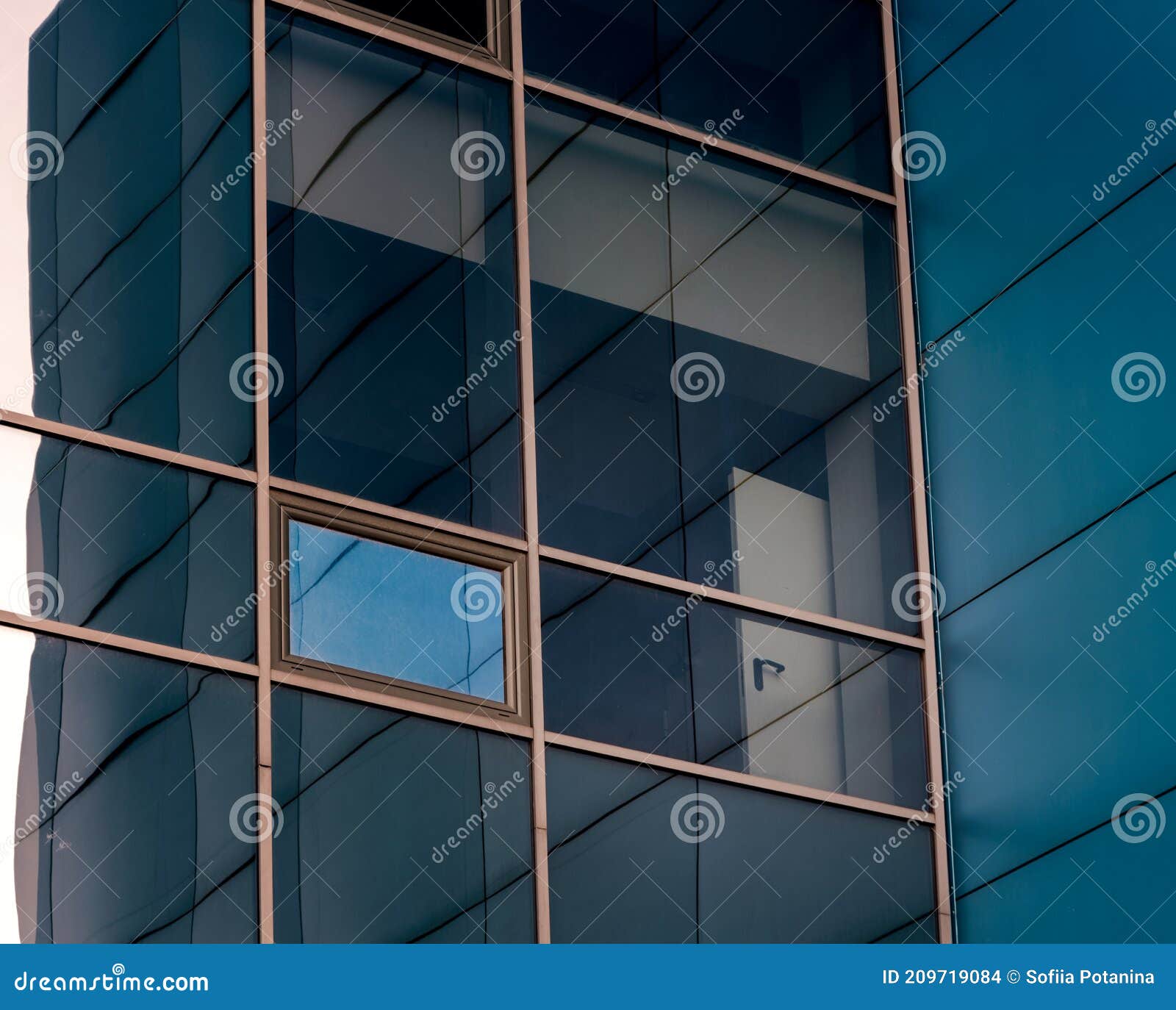 Mirrored Windows of the Facade of an Office Building with Blue Panels ...
