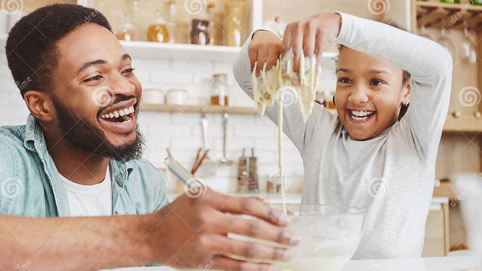 Mischievous Little Girl and Her Dad Playing with Dough Stock Image ... Mischievous Little Girl and Her Dad Playing with Dough Stock Image ...