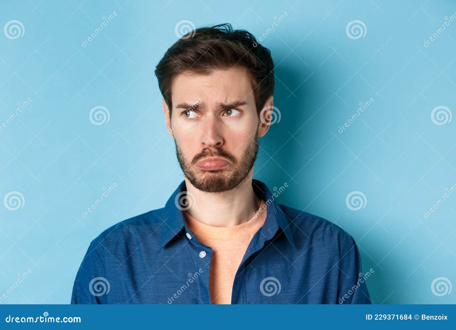 Miserable and Disappointed Guy Acting Childish, Sulking and Looking ...