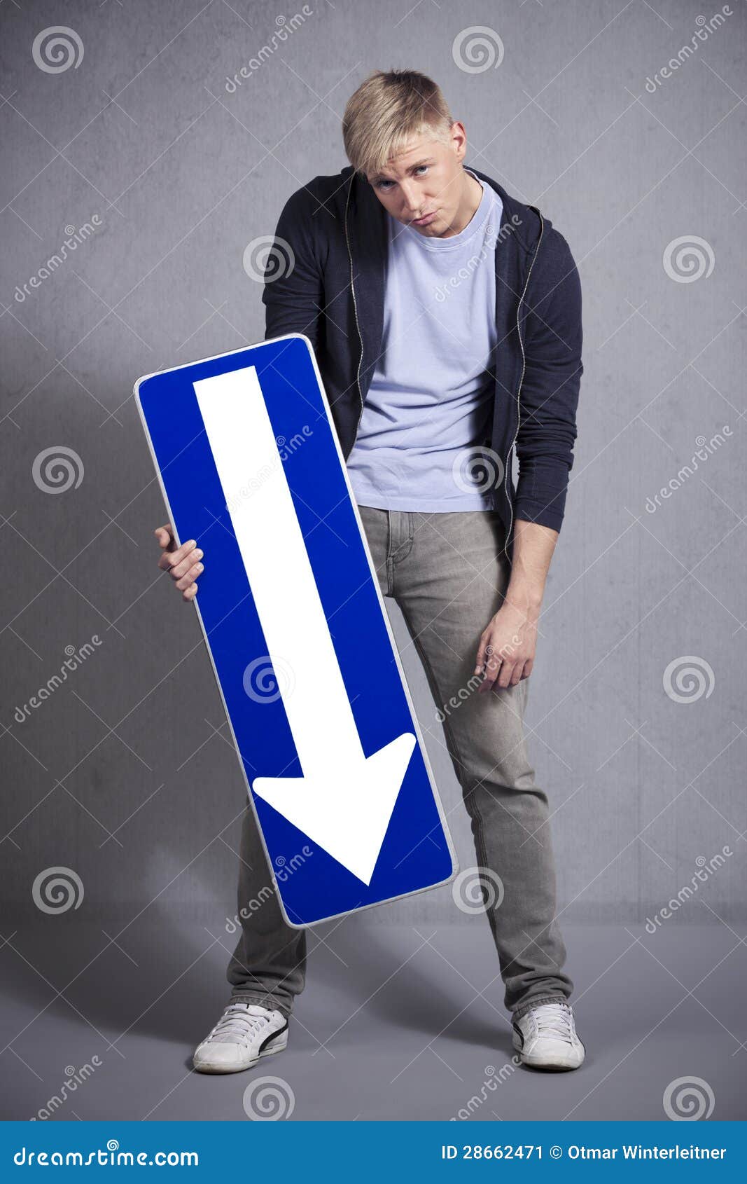 Miserable Man Holding Direction Arrow Sign Pointing Down. Stock Image ...