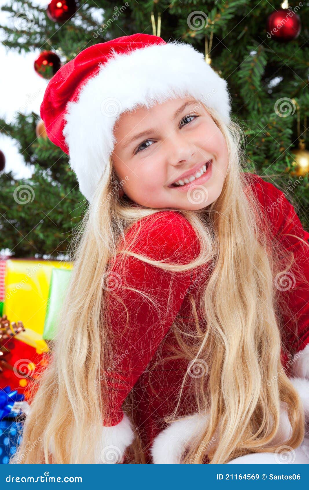 Miss Santa before Christmas Tree and Gifts Stock Image - Image of ...