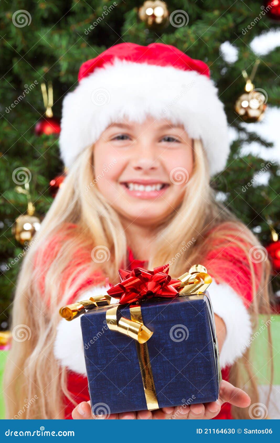 Miss Santa Holding a Gift and Smiling Stock Photo - Image of nicholas ...