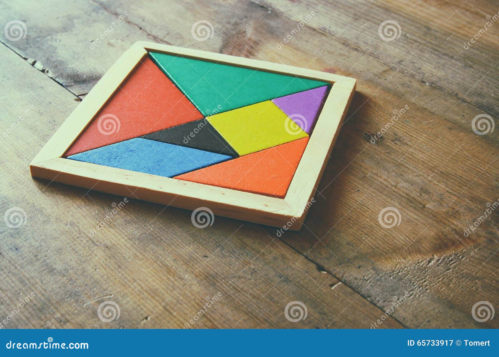 A Missing Piece in a Square Tangram Puzzle, Over Wooden Table. Stock ...
