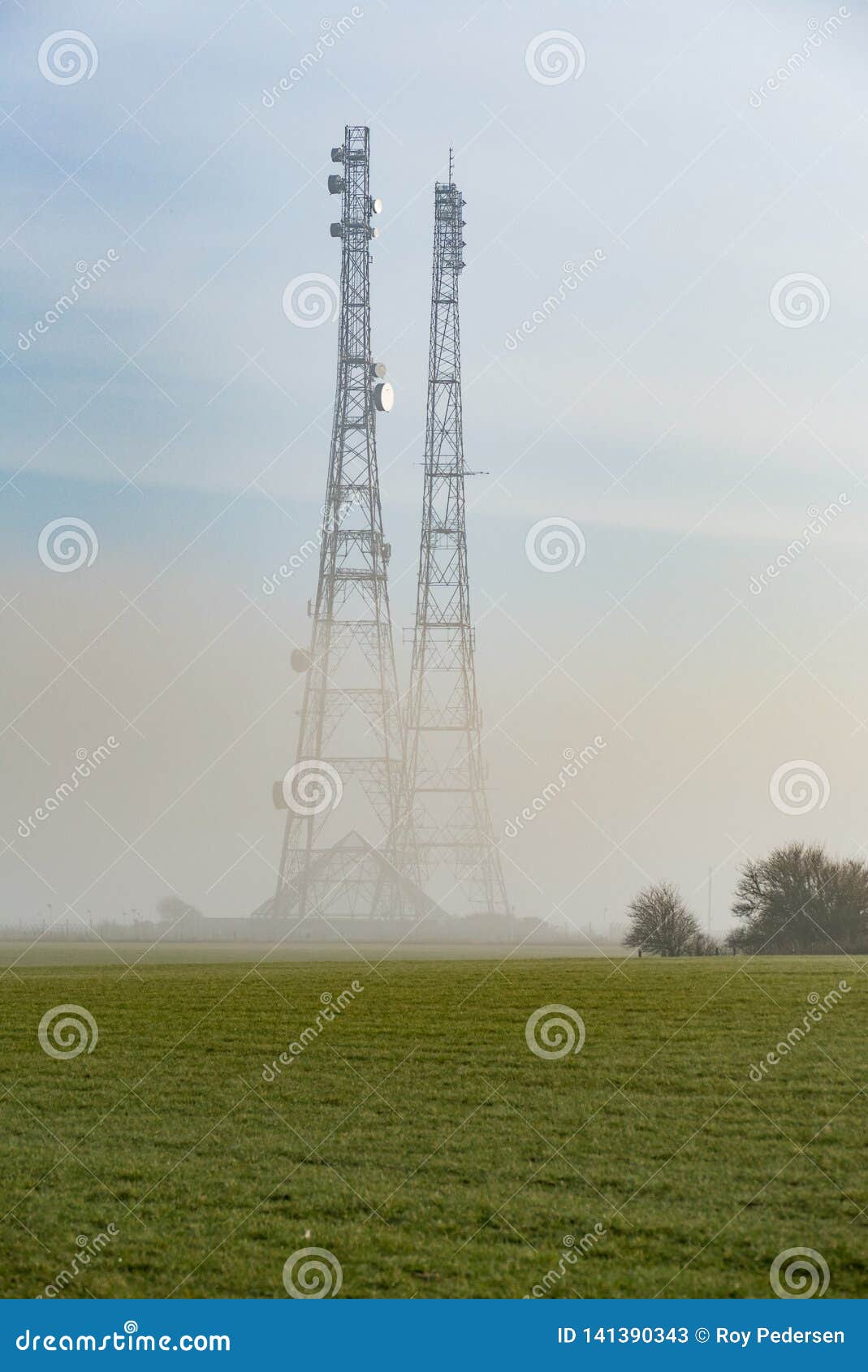 Mist Covered Communication Masts in a Field Stock Image - Image of ...