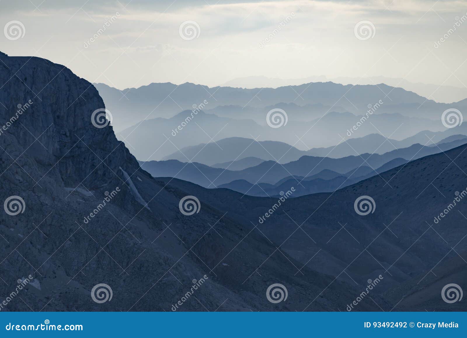 Mist over mountain range stock photo. Image of hillside - 93492492