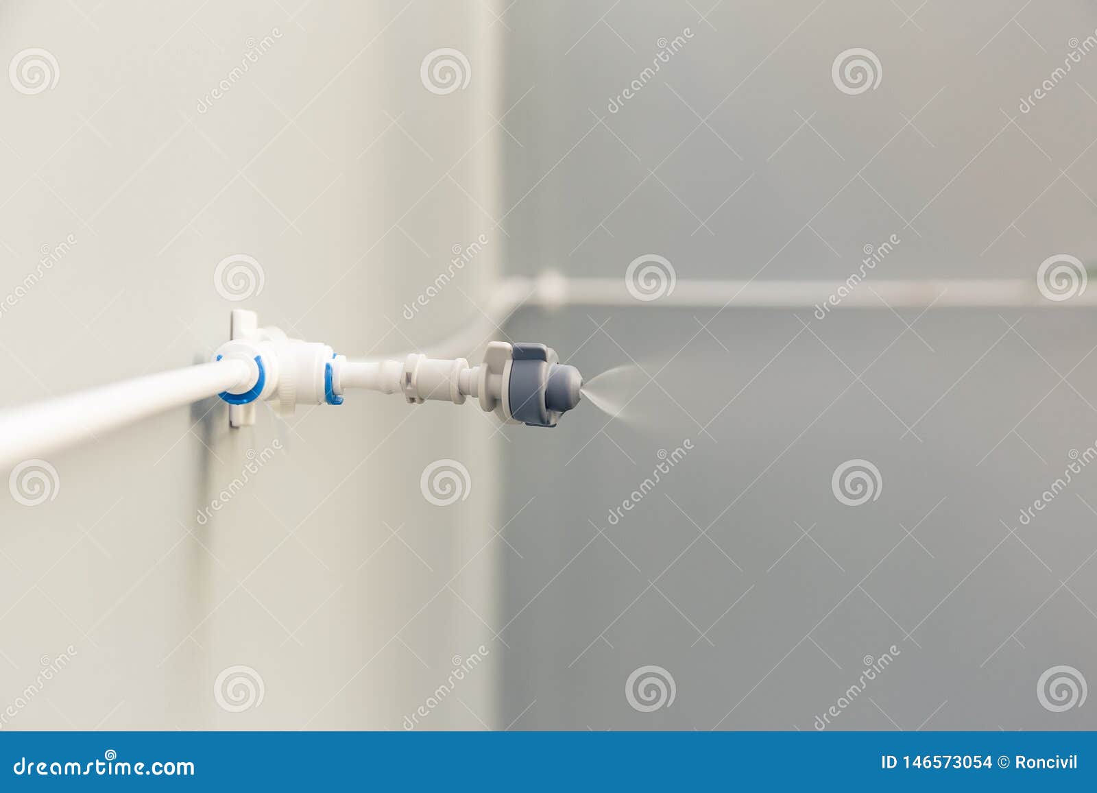 Misting sprinkler garden stock photo. Image of field - 146573054