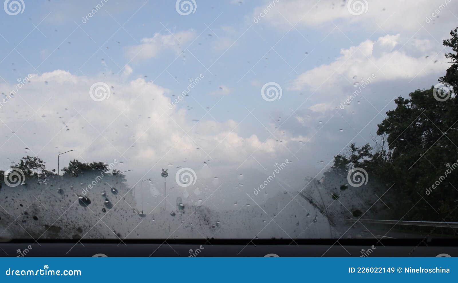 Misting Glass of Windshield with Raindrops and Blurred Background Stock ...