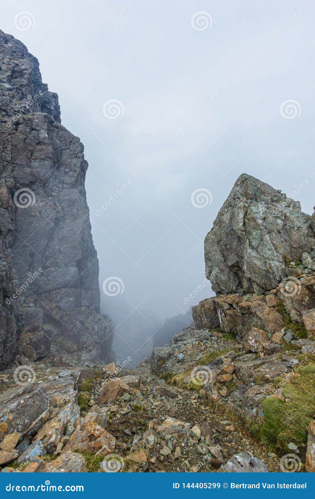 A Misty Mountain Gully View with Fog and White Altitude Clouds Stock ...