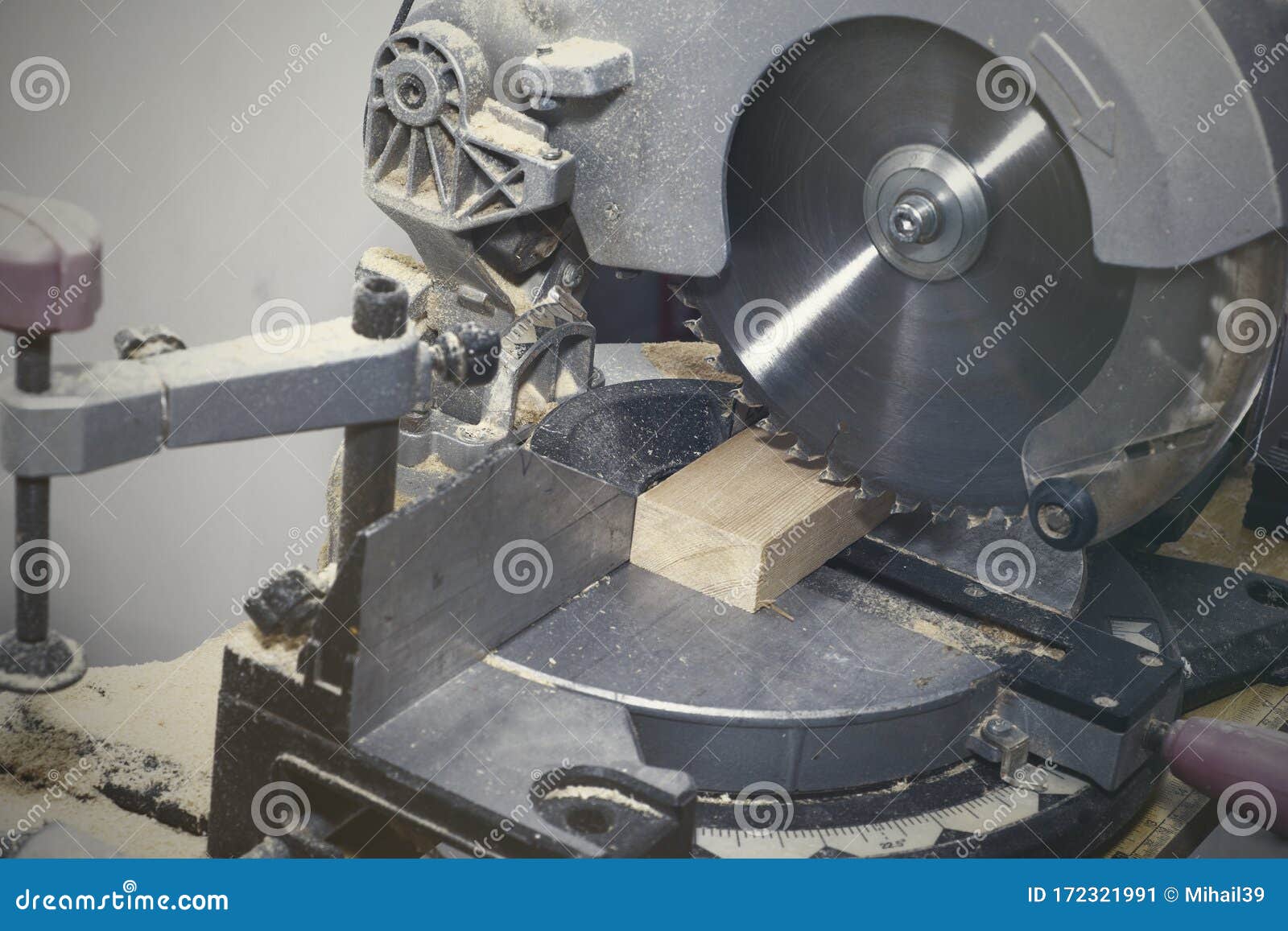 A Miter Saw Making a Compound Cut through Construction Lumber Stock ...