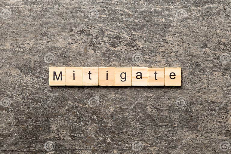 Mitigate Word Written on Wood Block. Mitigate Text on Table, Concept ...
