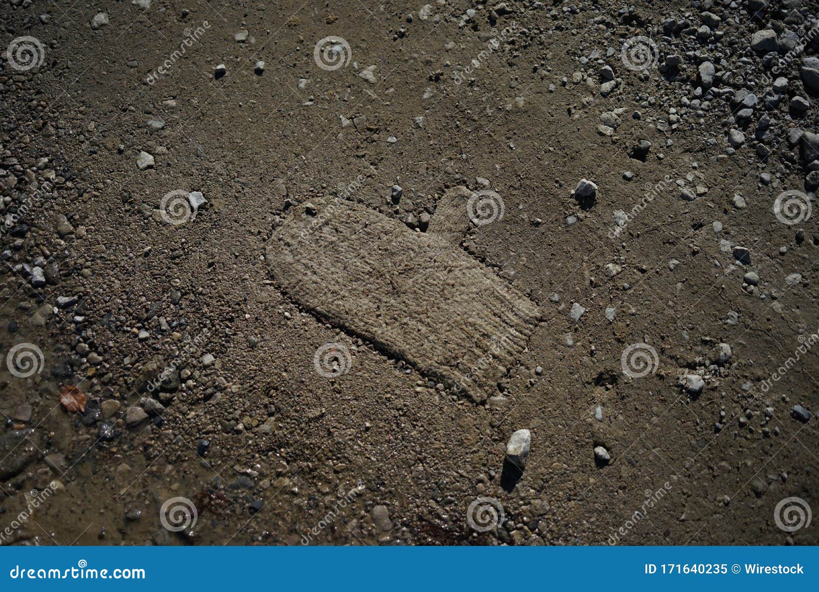 Mitten almost Buried in Soil Surrounded by Many Rocks Stock Image ...