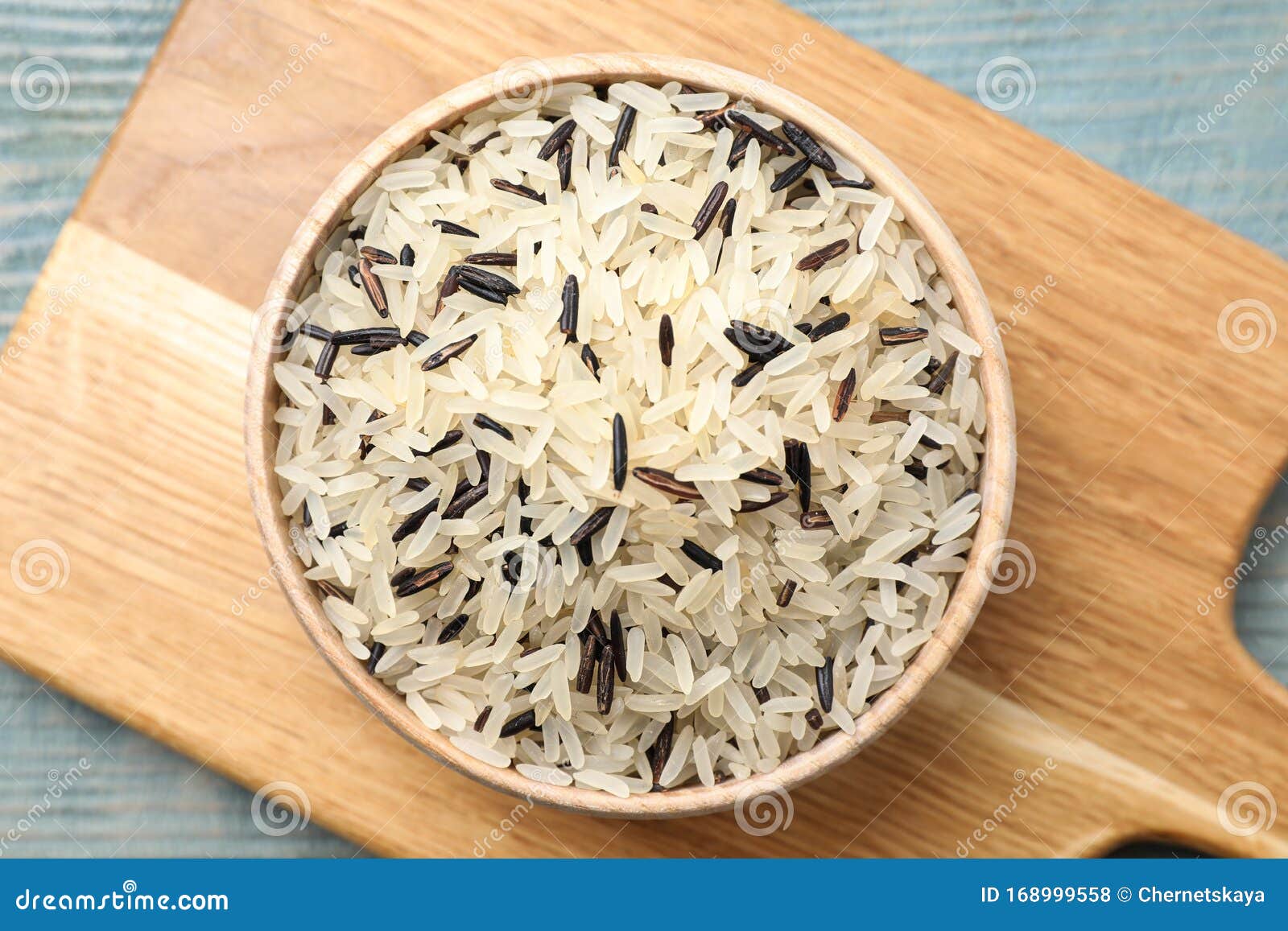 Mix of Brown and Polished Rice on Wooden Table Stock Photo - Image of ...