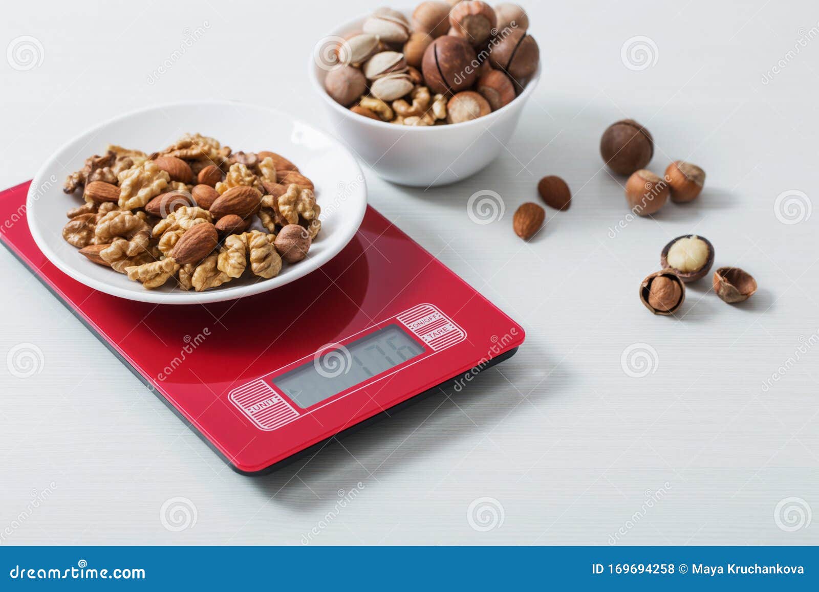 Mix of Different Nuts on Kitchen Scale on White Table Stock Photo ...