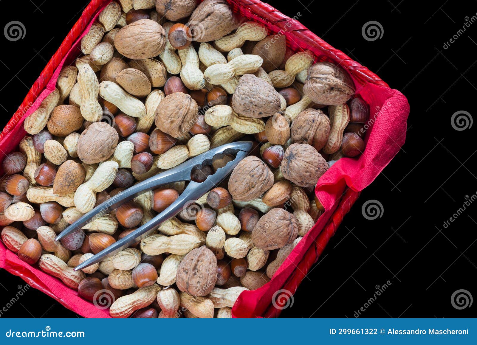Mix of Dried Fruit with Shell in a Red Basket with a Nutcracker Stock ...