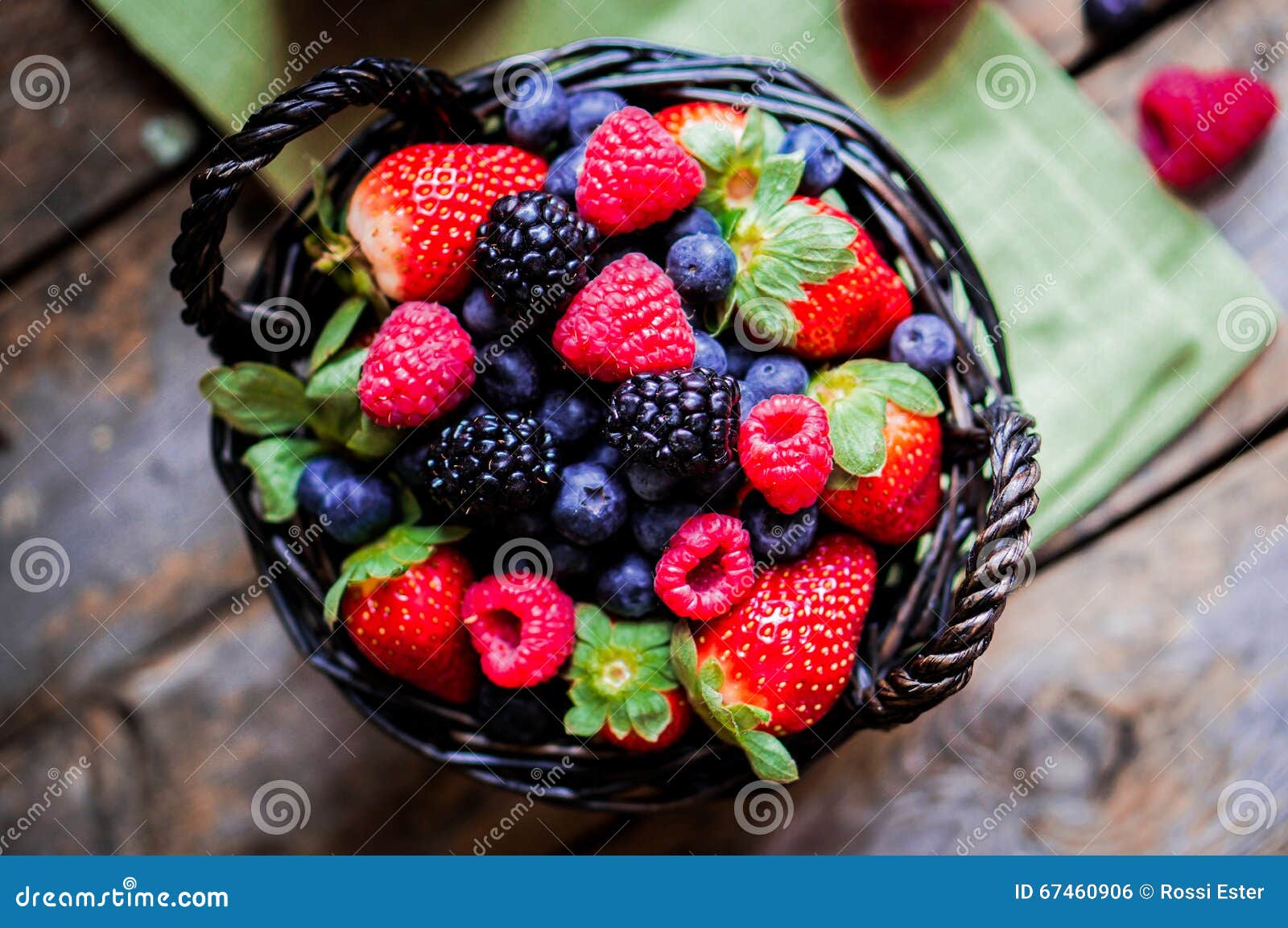 Mix of Fresh Berries in a Basket on Rustic Wooden Background Stock ...