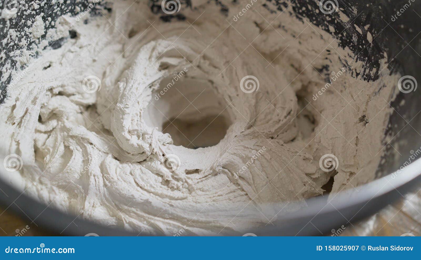 Mix the Solution in a Bucket Using a Construction Mixer. Worker Mixing ...