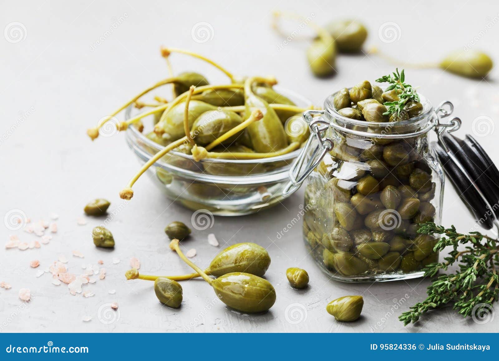 Mixed Capers in Jar and Bowl on White Kitchen Table. Stock Photo ...