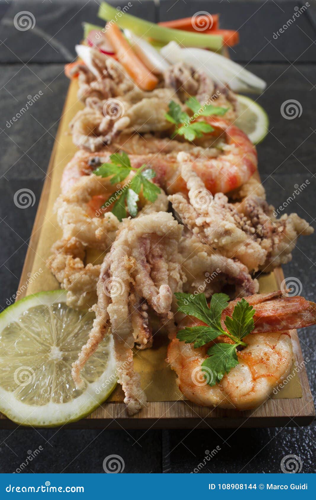 Mixed fried fish stock photo. Image of lemon, vegetable - 108908144