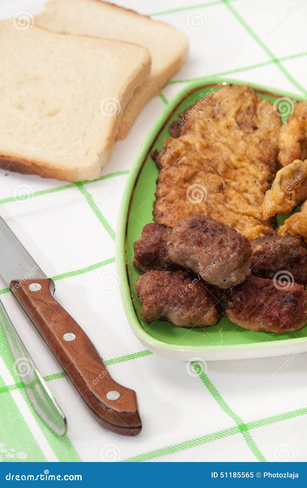 Mixed Meat Served with Bread and a Knife and Fork Stock Image - Image ...