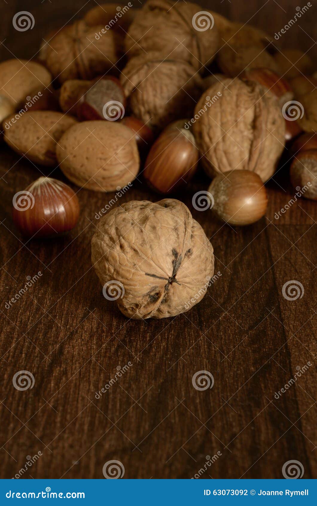 Mixed Nuts in Shells on Rustic Wood Stock Photo - Image of pile ...