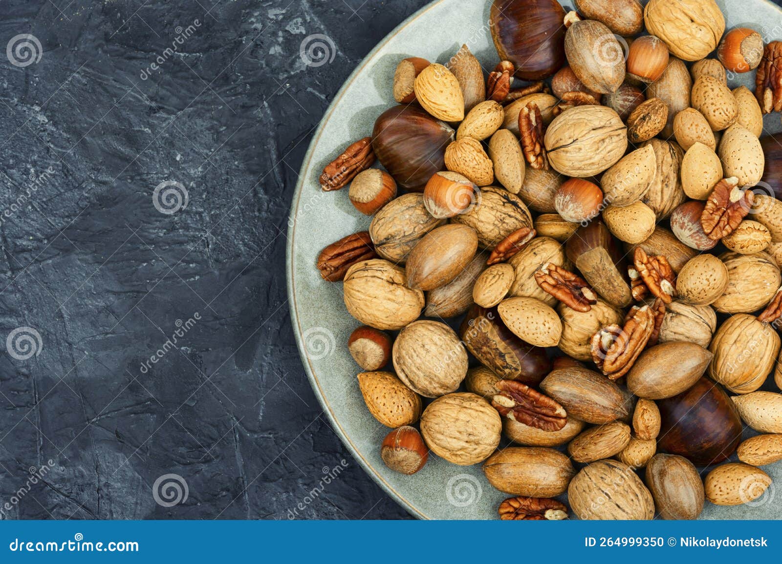 Mixed nuts on the table stock photo. Image of filbert - 264999350