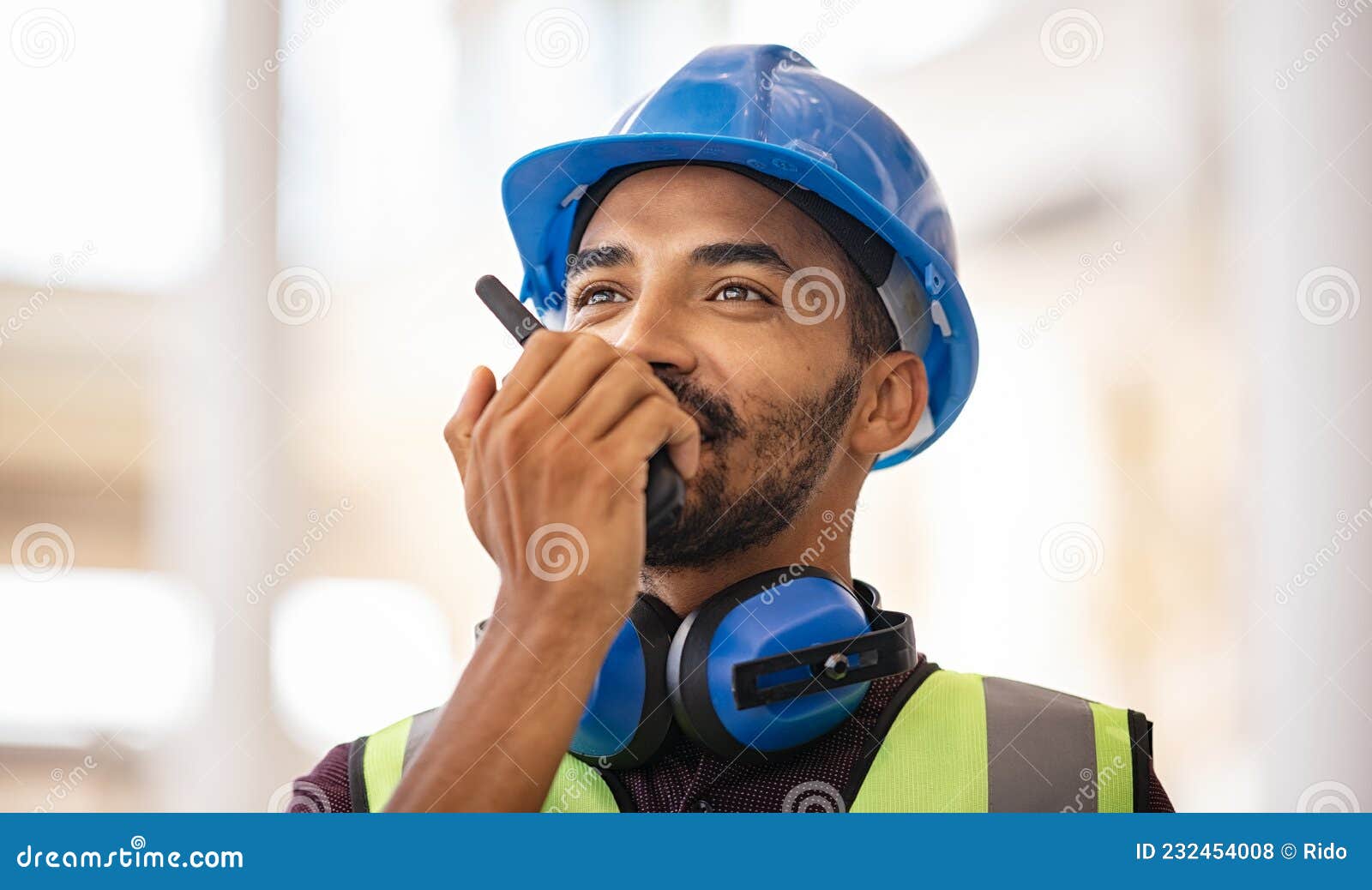 Mixed Race Construction Worker Using Walkie on Construction Site Stock ...